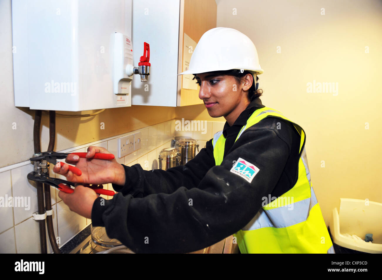A Young Plumbing Apprentice practices at a training centre in Bradford ...