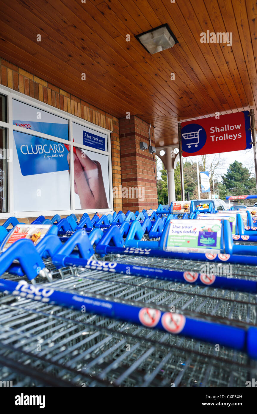 Trolleys outside a Tesco supermarket with a clubcard sign in the ...