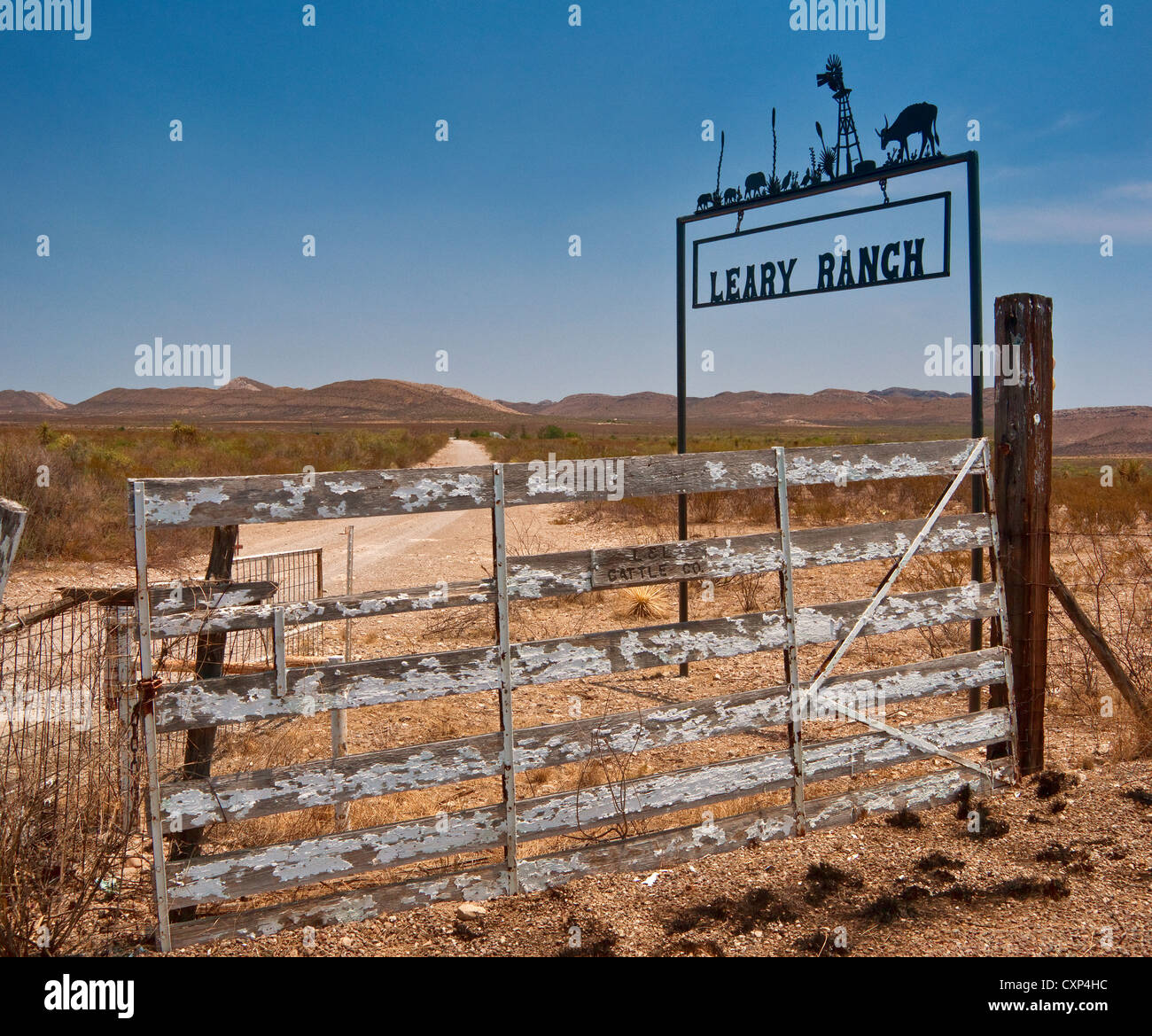 Wrought iron sign at road to ranch in Chihuahuan Desert near Marathon ...
