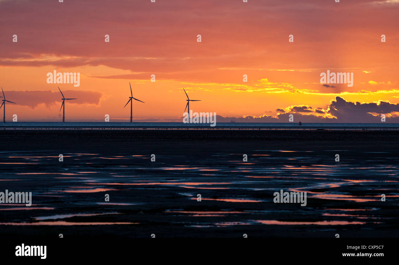 Coastal Sunset with Wind Turbines Stock Photo - Alamy