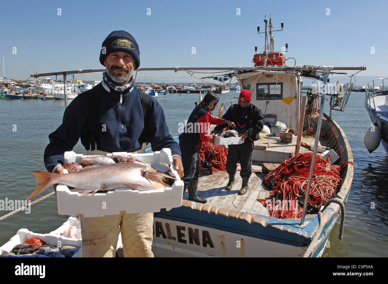 Europe Italy Sardinia Fisherman with fish, Sardinia Stock Photo - Alamy