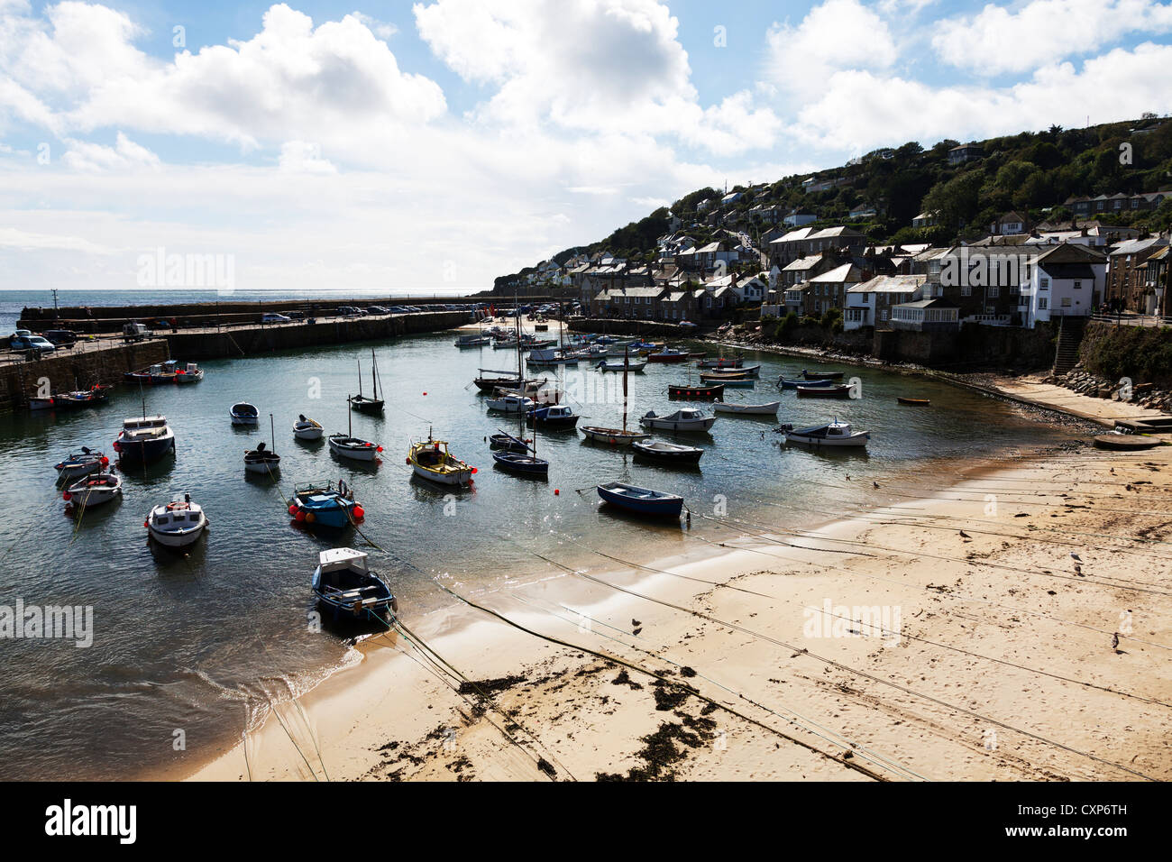 Mousehole harbor harbour Cornwall small fishing boats moored with ...