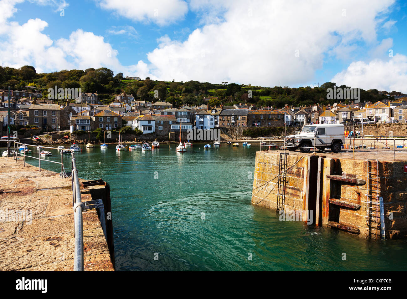 Mousehole harbor harbour Cornwall small fishing boats moored with ...