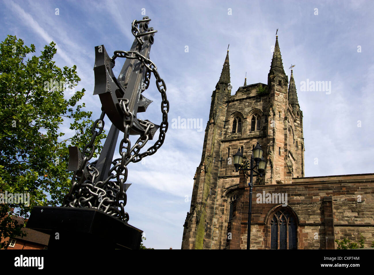 The Anchor statue in front of the church of St. Editha in the centre of ...