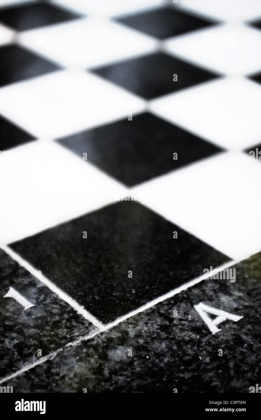 Close up of marble chess board with letter A and number 1 curved in it ...