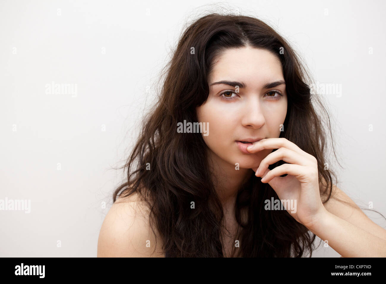 Young woman with worried expression Stock Photo - Alamy