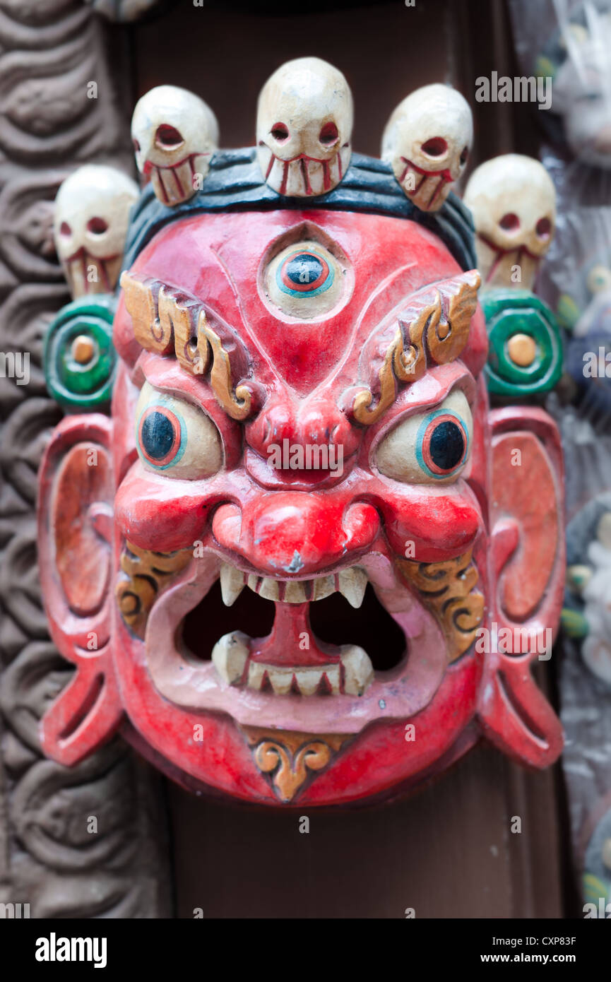 Colorful Buddhist mask on a temple wall Stock Photo - Alamy