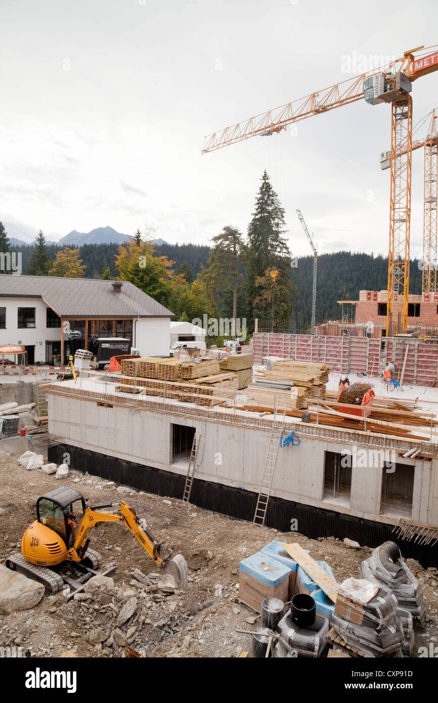 Swiss construction workers building a new block of flats, Flims ...
