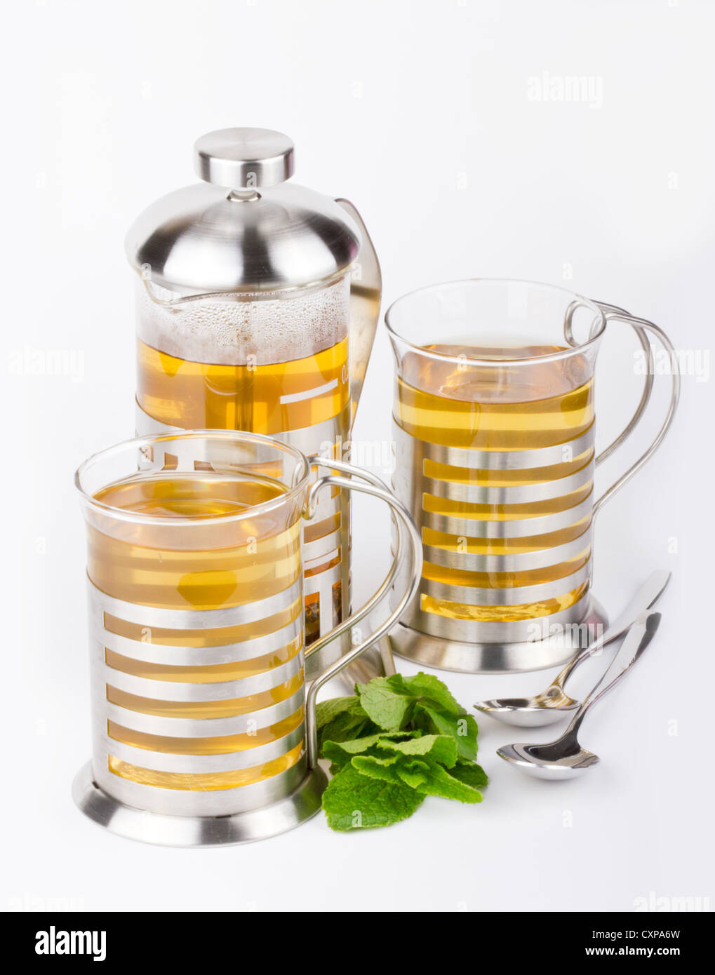 Teapot and cups from glass with mint Stock Photo - Alamy