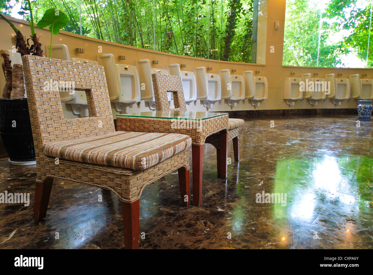 Rattan chairs and table inside a luxury public toilet Stock Photo - Alamy