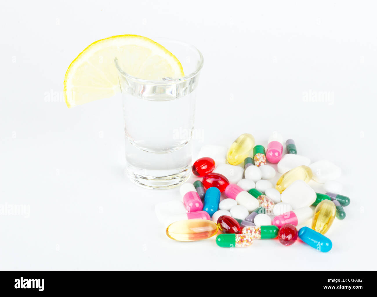 Alcohol and medicals on white background Stock Photo - Alamy