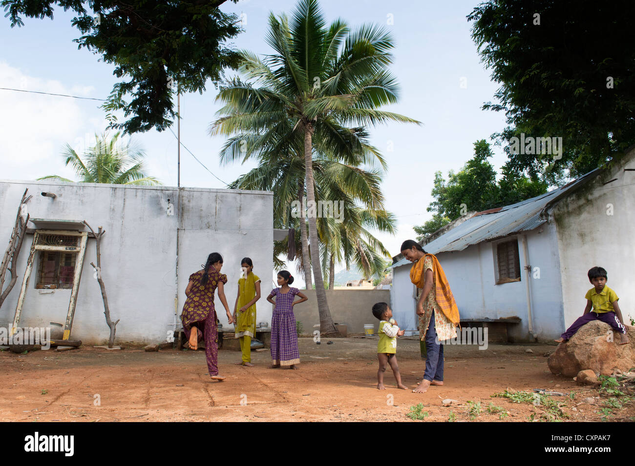 Indian kids playing game outside house hi-res stock photography and ...