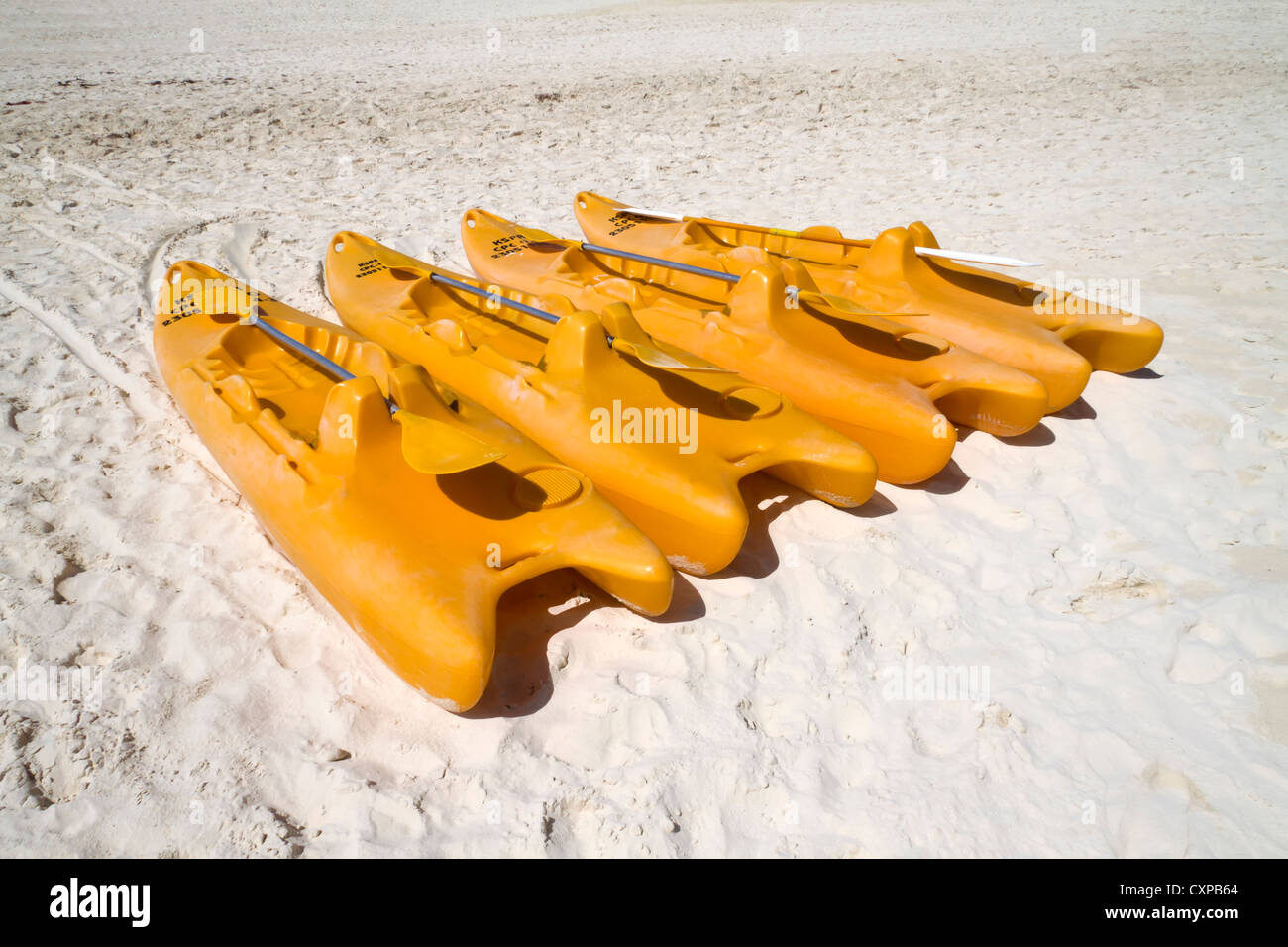 A group of empty orange paddle boats Stock Photo - Alamy