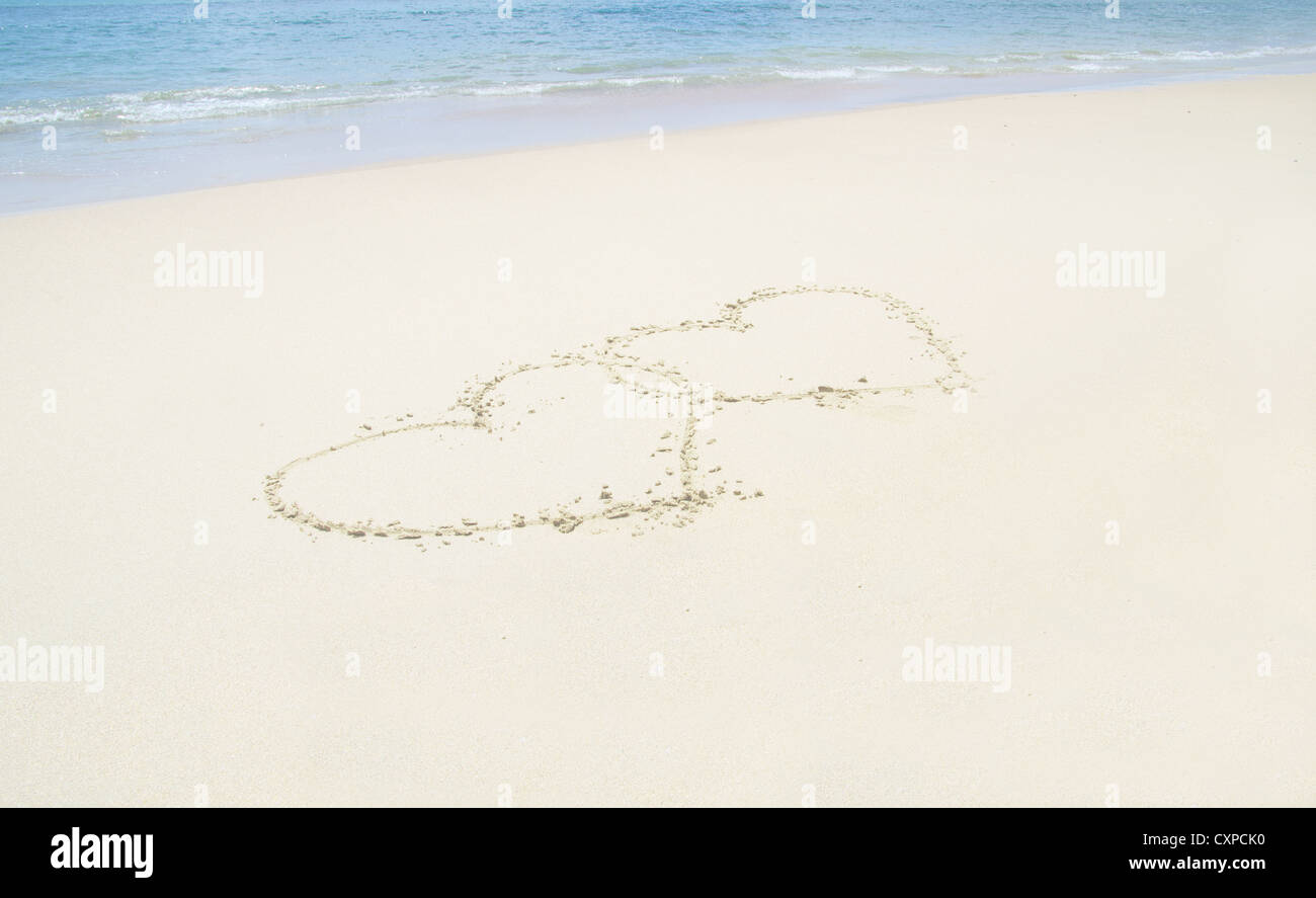 hearts drawn in the sand Stock Photo - Alamy