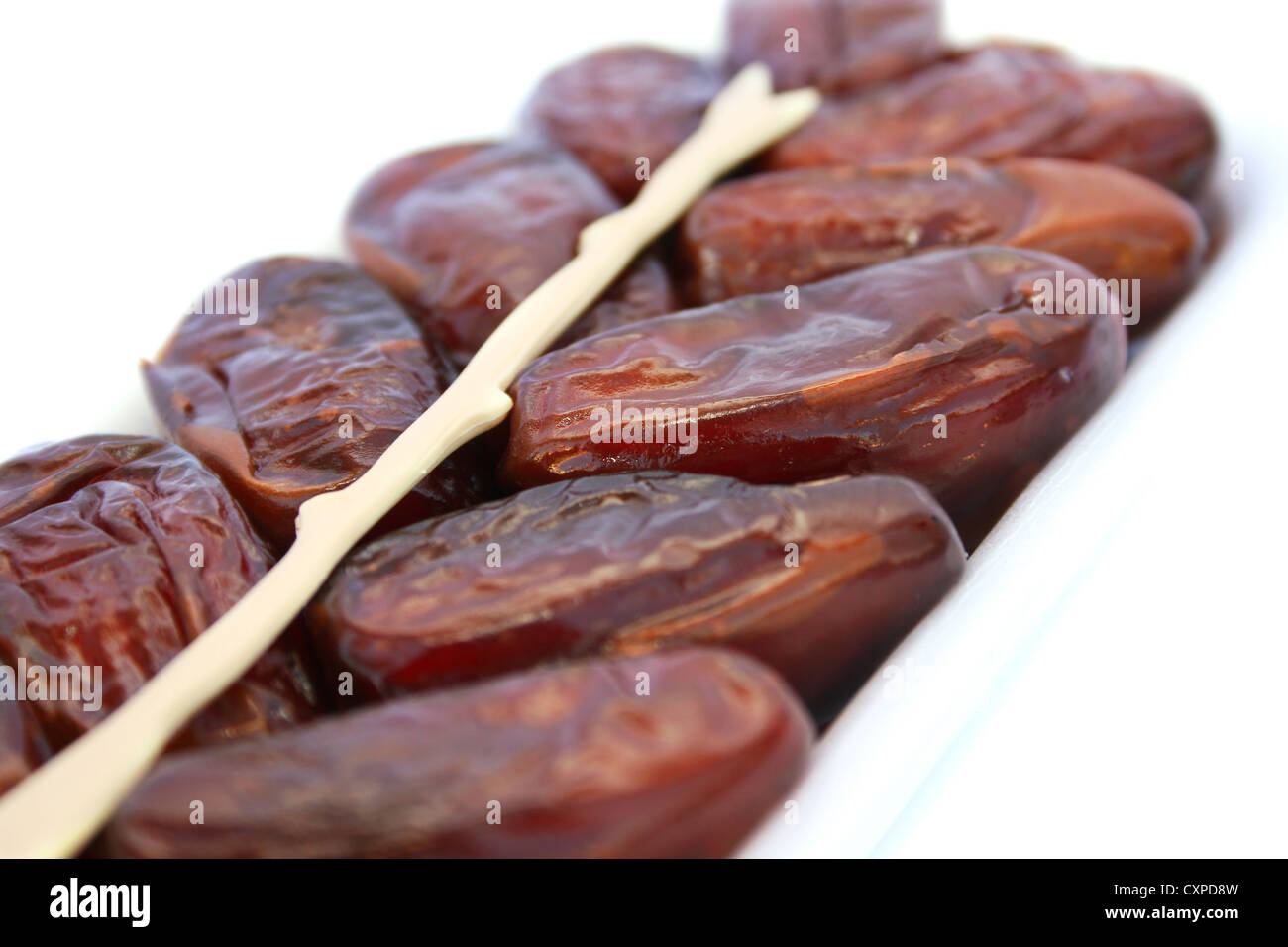 Dates isolated on white background Stock Photo - Alamy