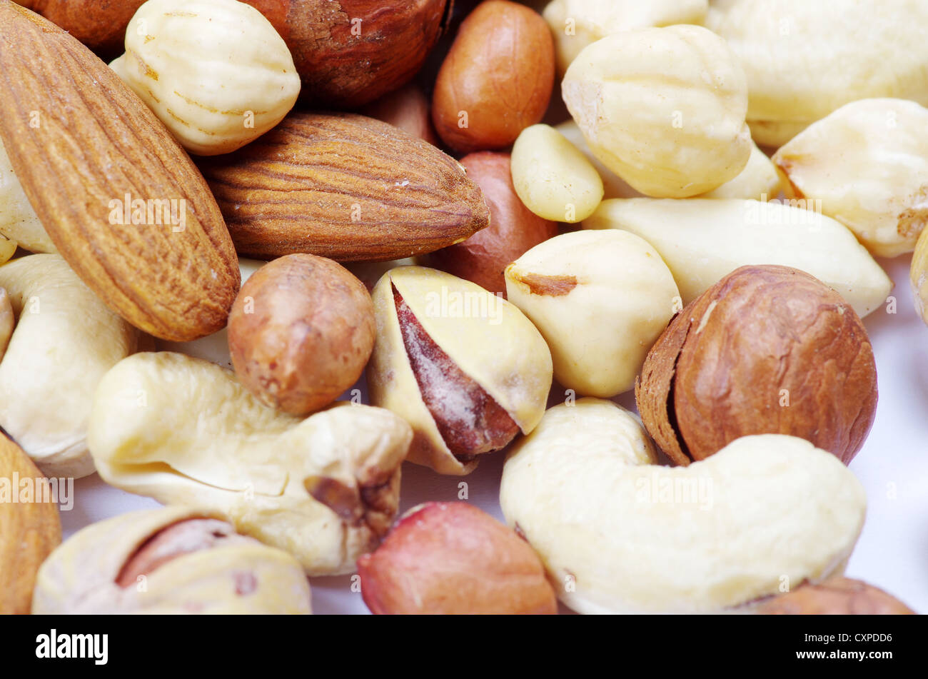 mixed nuts on a background Stock Photo - Alamy