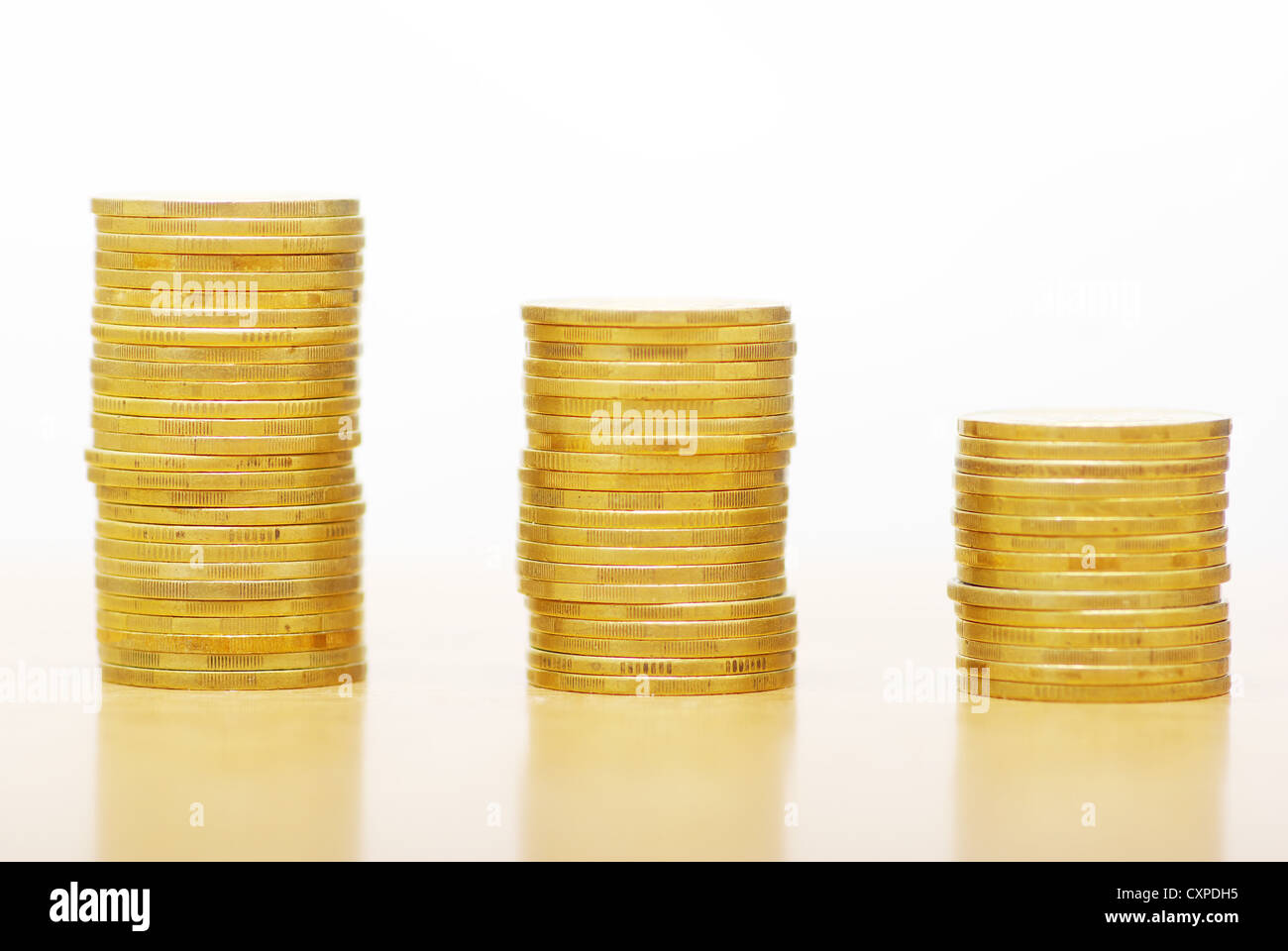 towers of coins isolated on a whiteness Stock Photo - Alamy