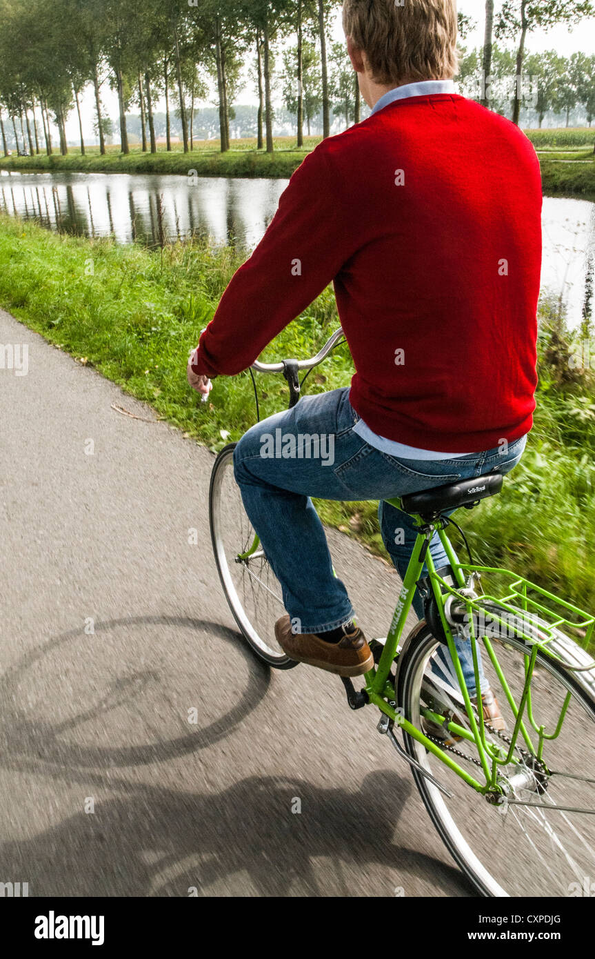 Cycling next to canal, outside Brugge Stock Photo - Alamy