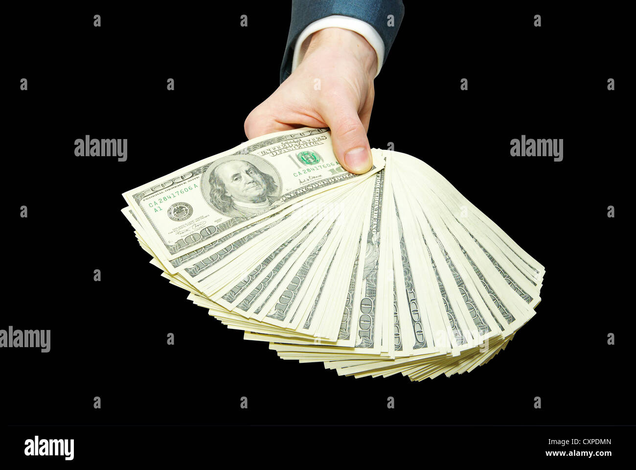 Hand with money isolated on black background Stock Photo - Alamy