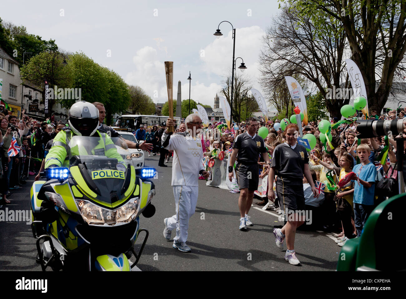 John Parham, 63, from Truro, becomes the 53rd UK torch bearer, running ...