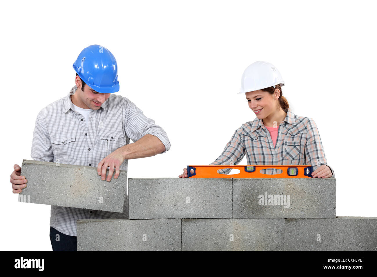 Man and woman building wall Stock Photo - Alamy