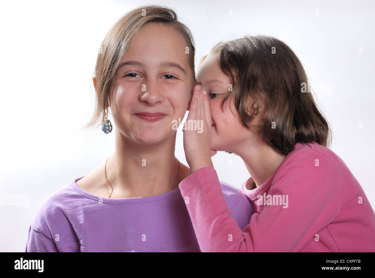 complicity between sisters Stock Photo - Alamy