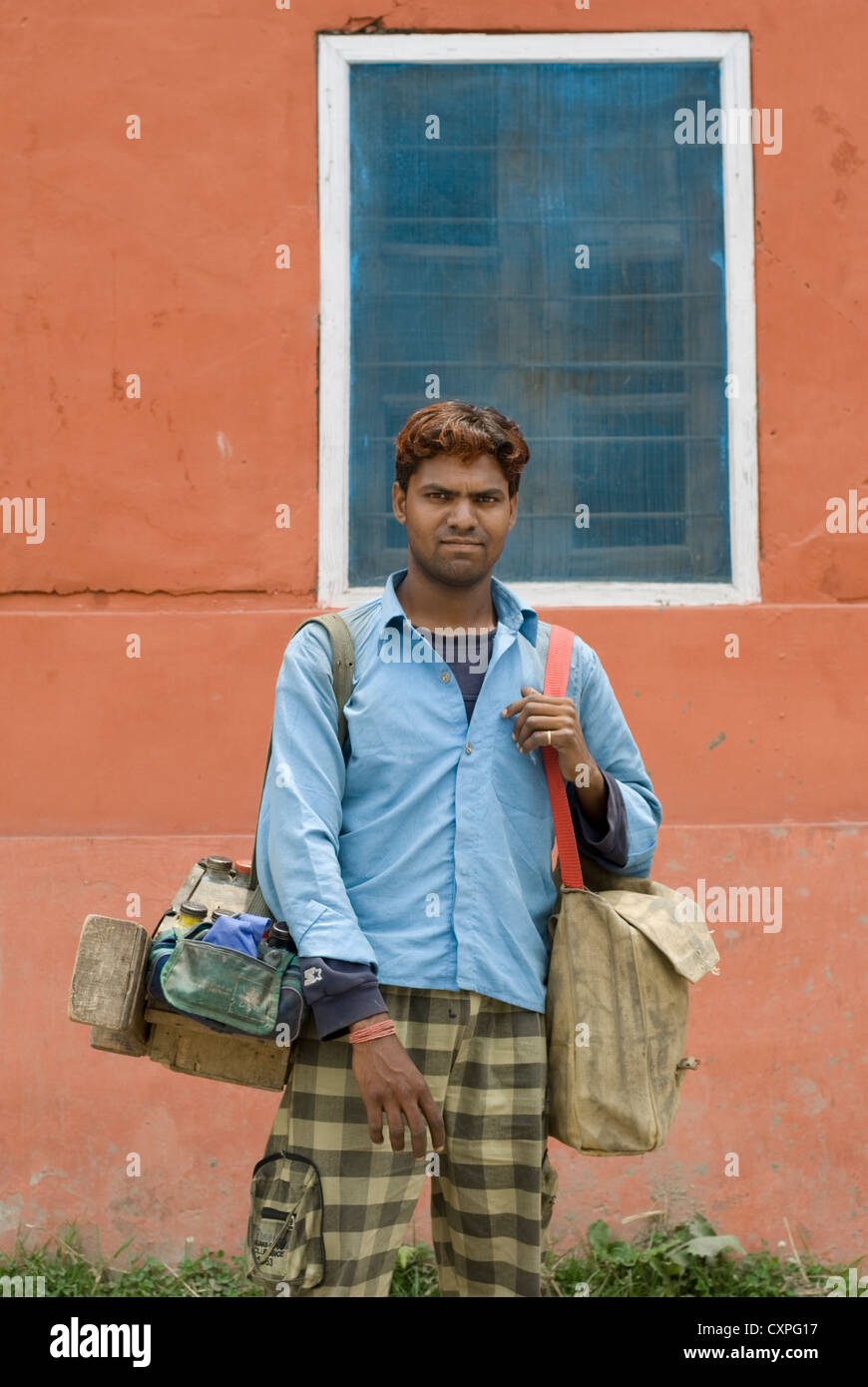 A shoe cleaner poses for the camera in Manali, Northern India Stock ...