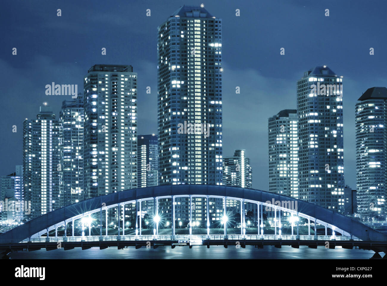 cold toned cityscape of night Tokyo, modern buildings at Tsukishima ...