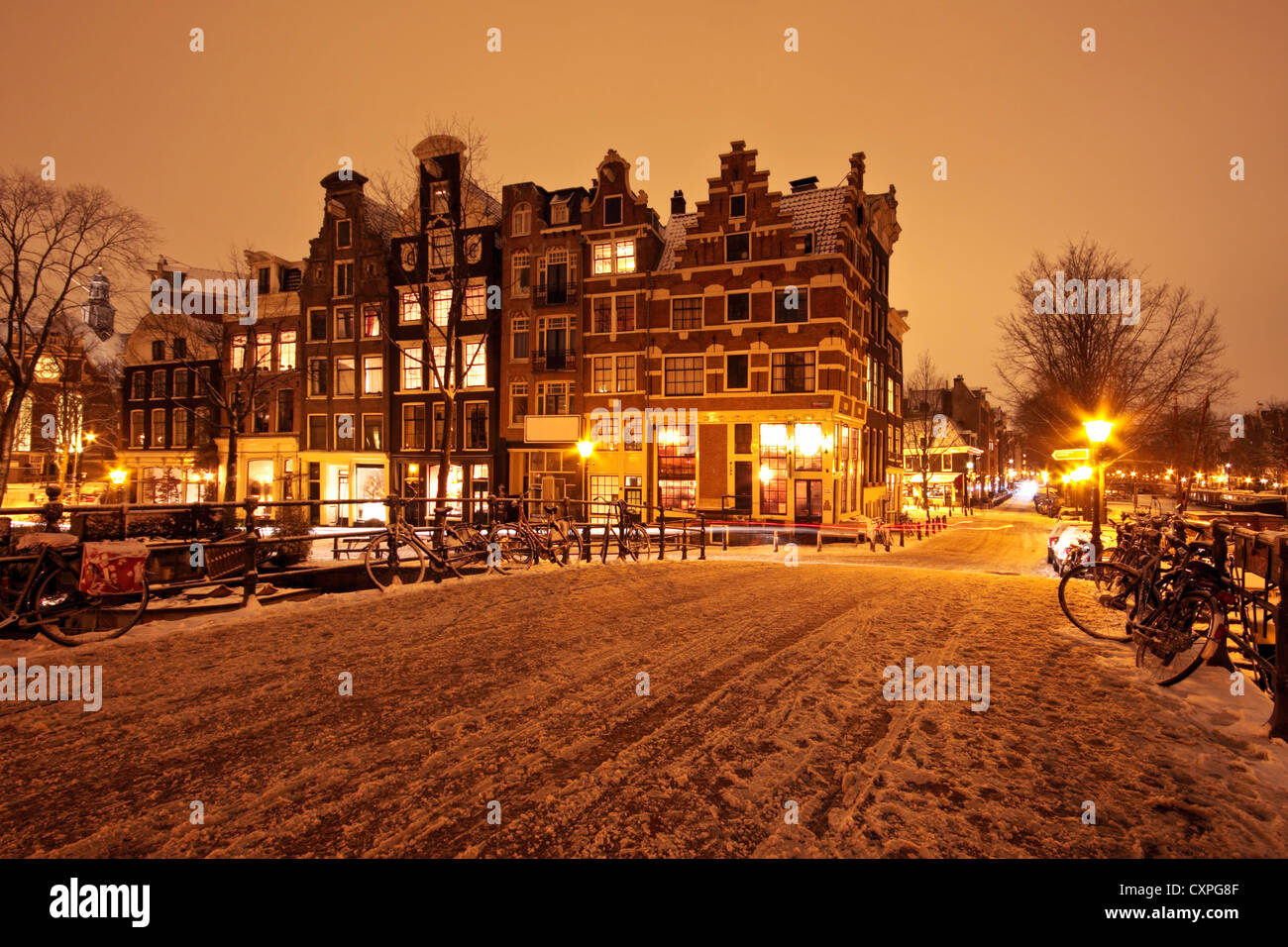 Snowy Amsterdam by night in the Netherlands Stock Photo - Alamy