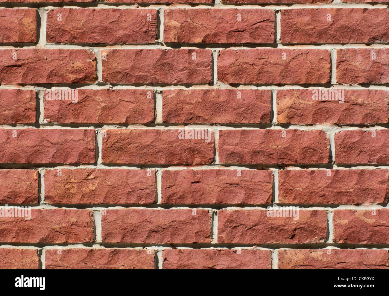 Tiled red stone wall Stock Photo - Alamy