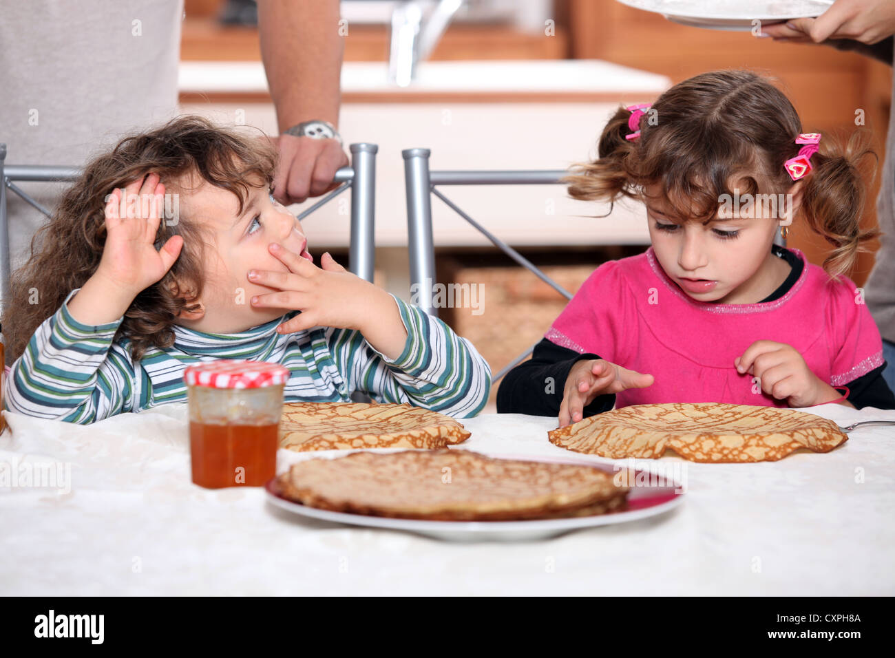 Children eating pancakes Stock Photo - Alamy