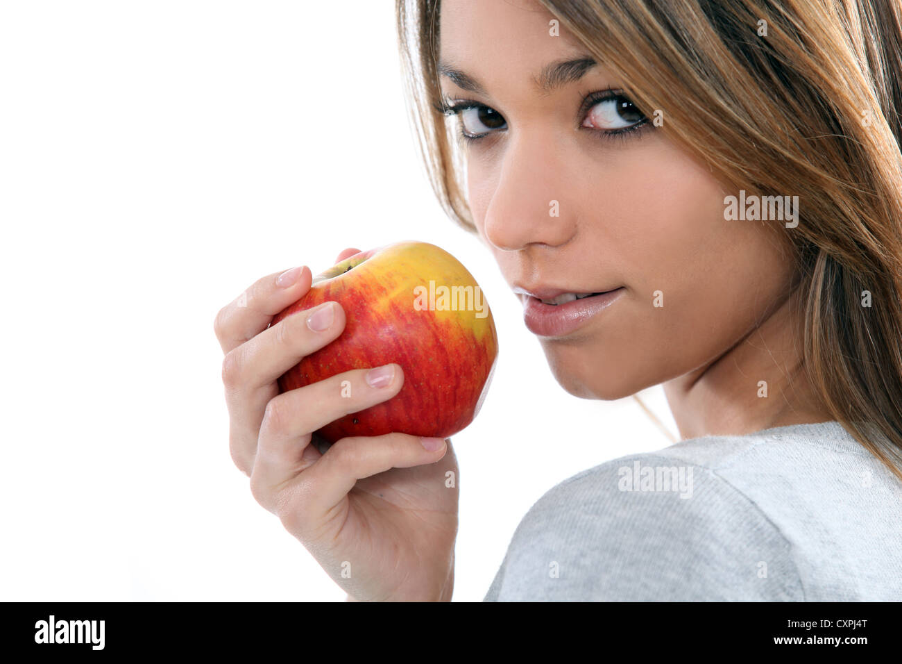 young woman holding an apple Stock Photo - Alamy
