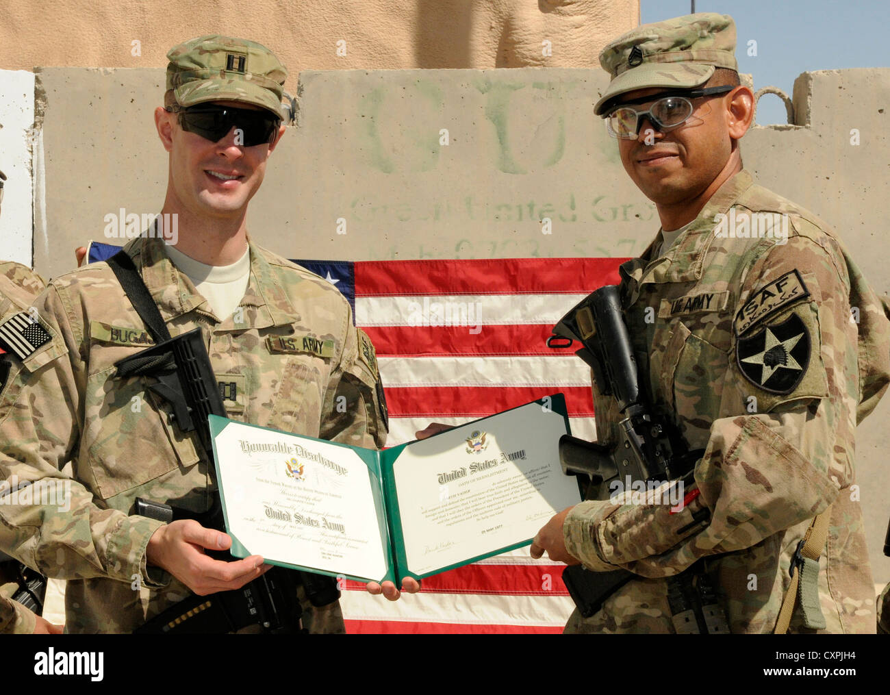 Staff Sgt. Josuel Cruz reenlists in the Army during a ceremony at ...