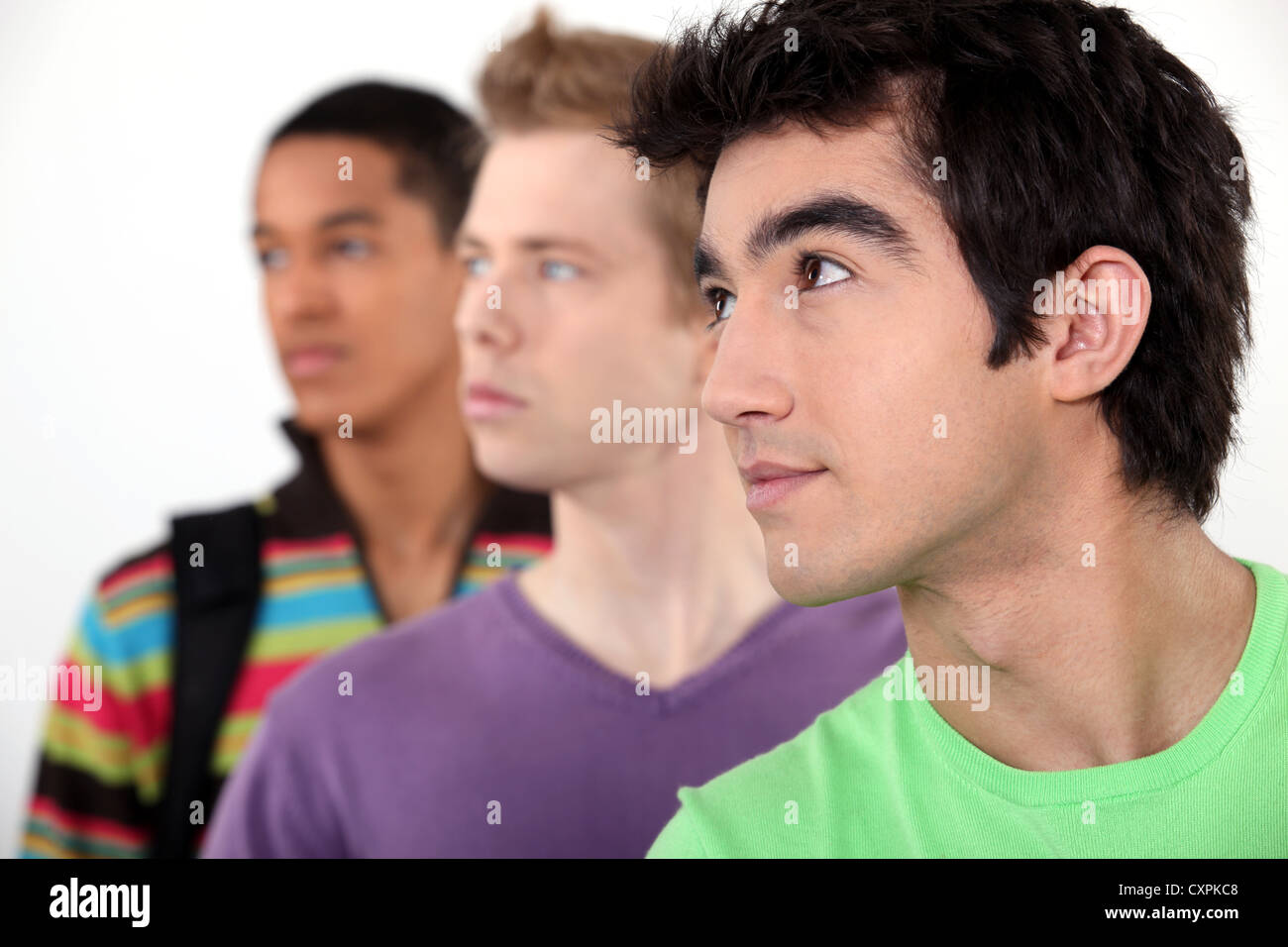 Three male student in line Stock Photo - Alamy