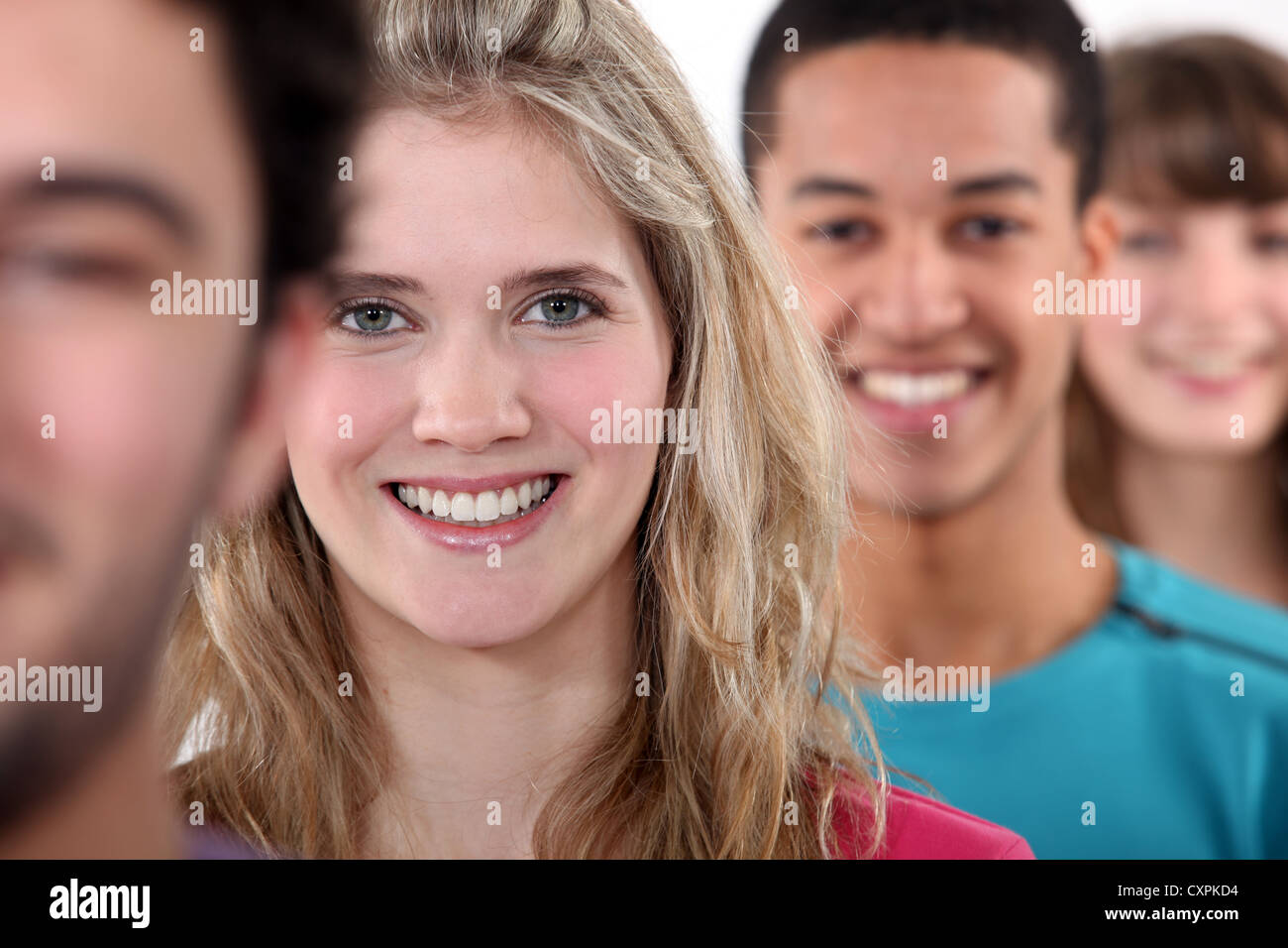 A row of young and smiley people Stock Photo - Alamy