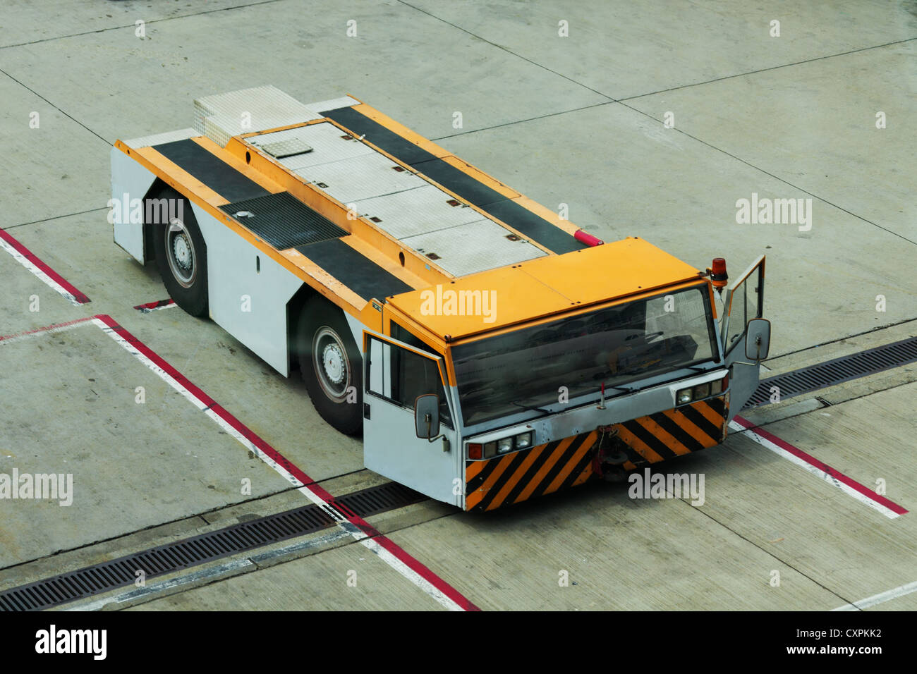 Airport grown crew service vehicle on the field Stock Photo - Alamy