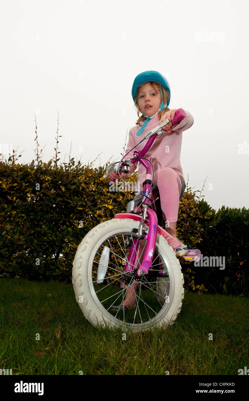 Child riding a bicycle Stock Photo - Alamy