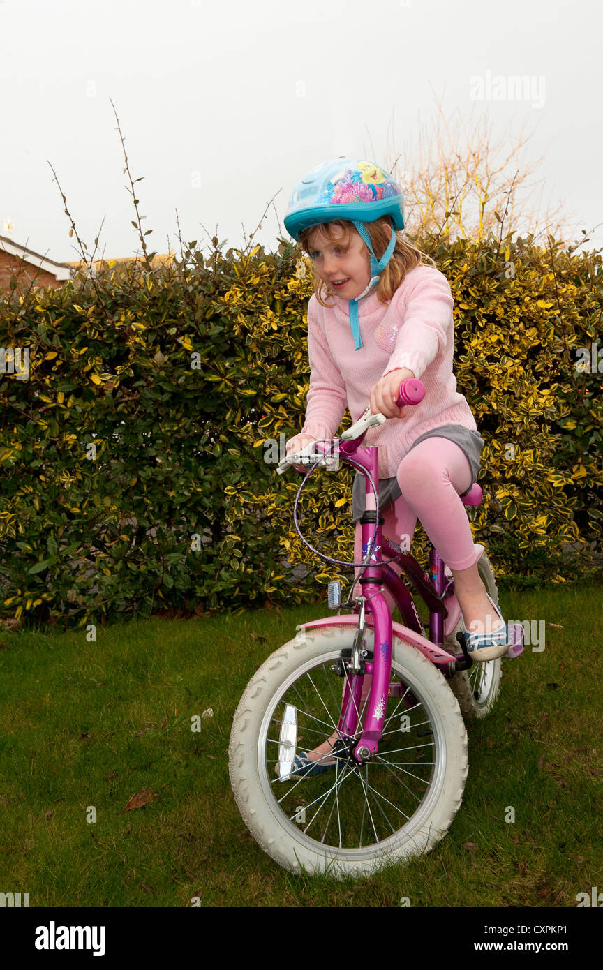 Child riding a bicycle Stock Photo - Alamy