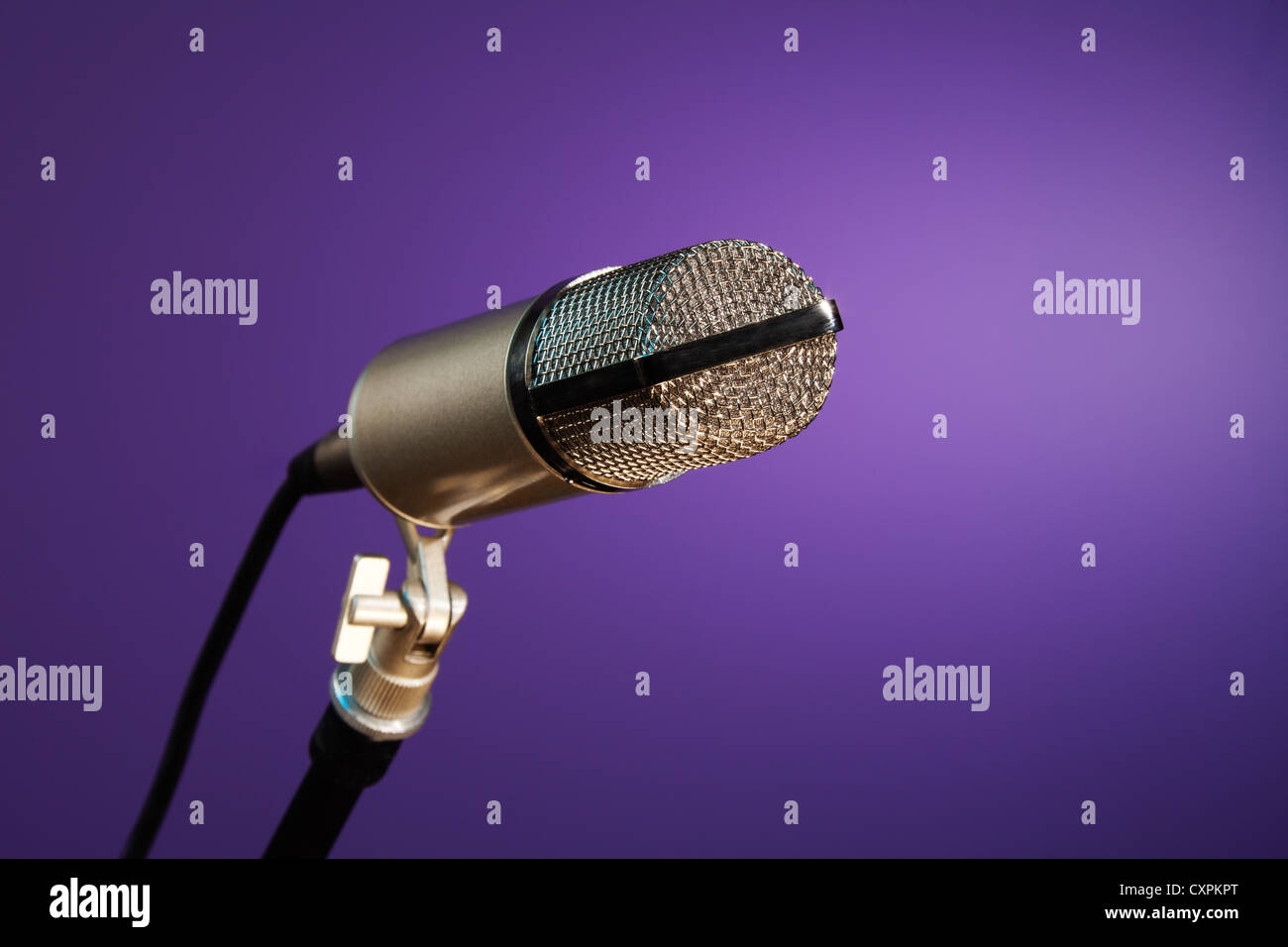 metallic microphone on purple background in the night clube Stock Photo ...