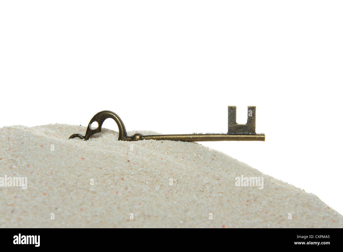 Key on sand isolated on white background Stock Photo - Alamy