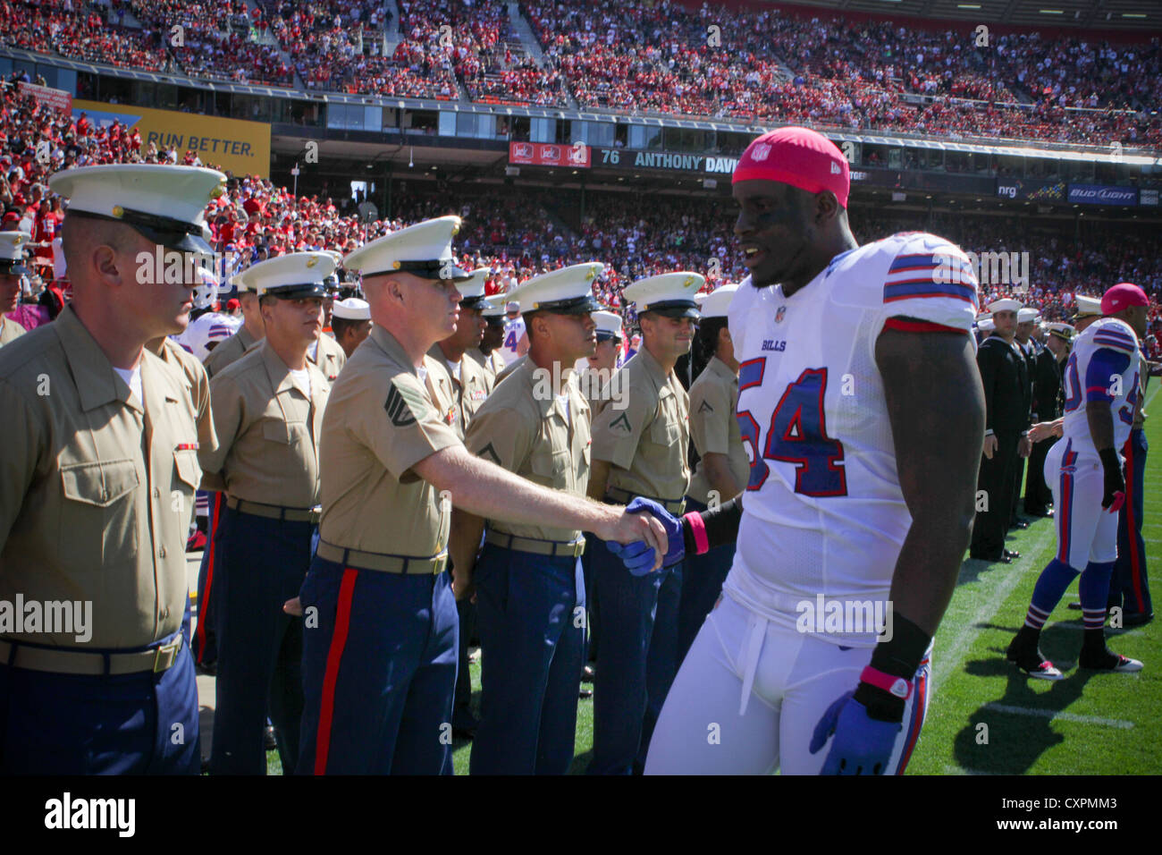 Buffalo Bills defensive end Kyle Moore greets Staff Sgt. Brandon ...