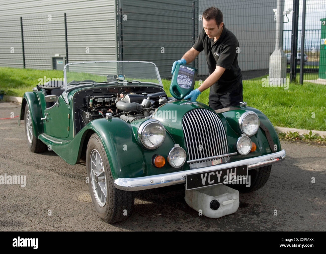 Pouring antifreeze coolant in radiator hi-res stock photography and ...