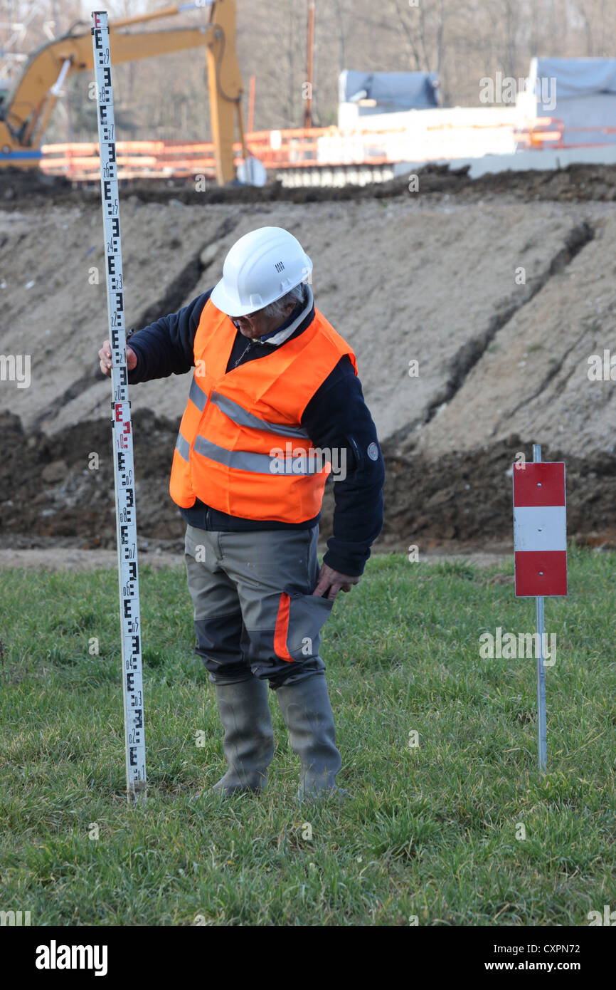 Worker with work rule Stock Photo - Alamy