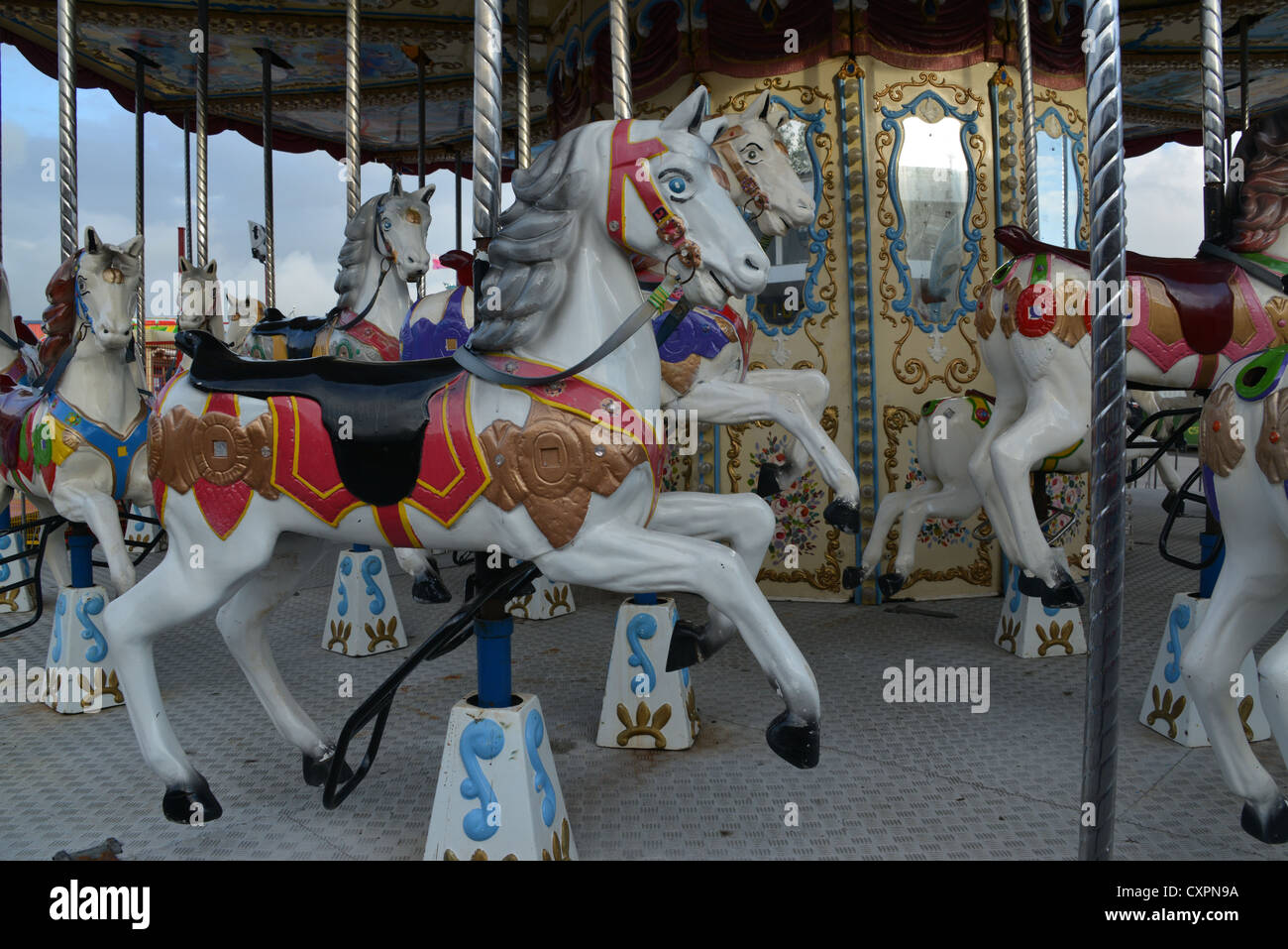 Gallopers horse carousel ride at fairground Stock Photo - Alamy