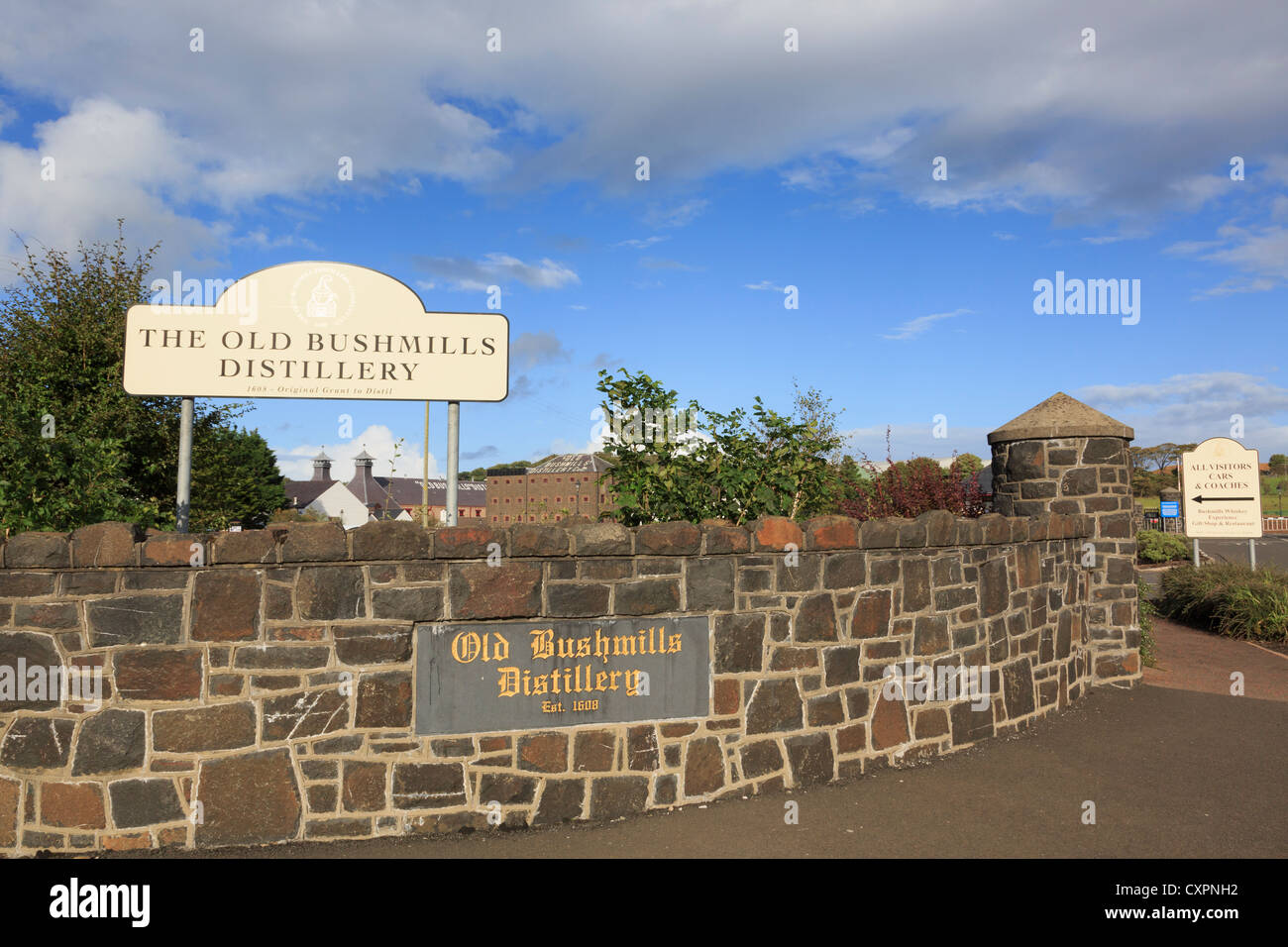Sign at entrance to Old Bushmills Distillery Co Ltd distillers of Irish ...