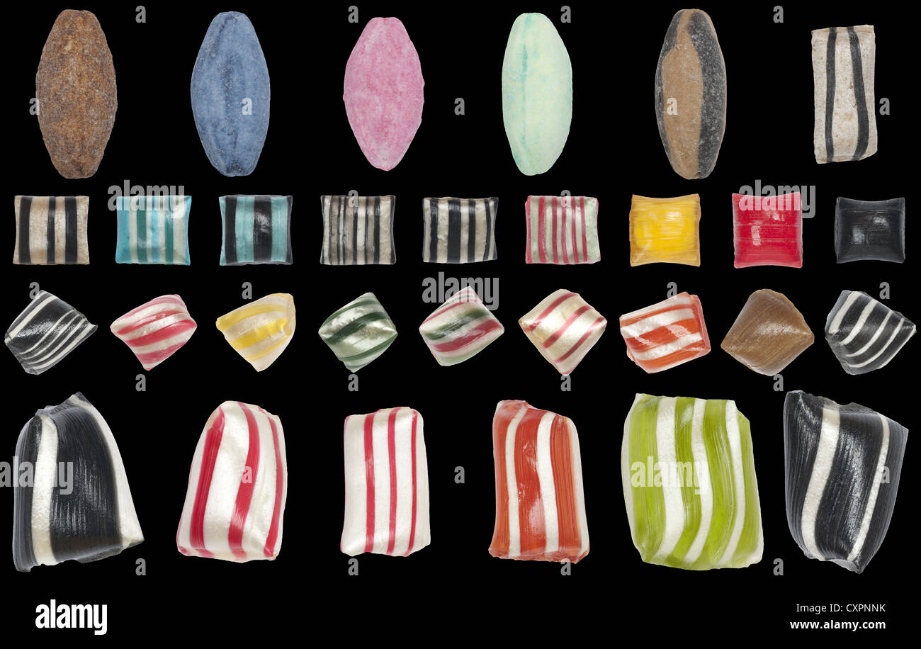 30 kinds of hard candy isolated with hard edges on a black background ...