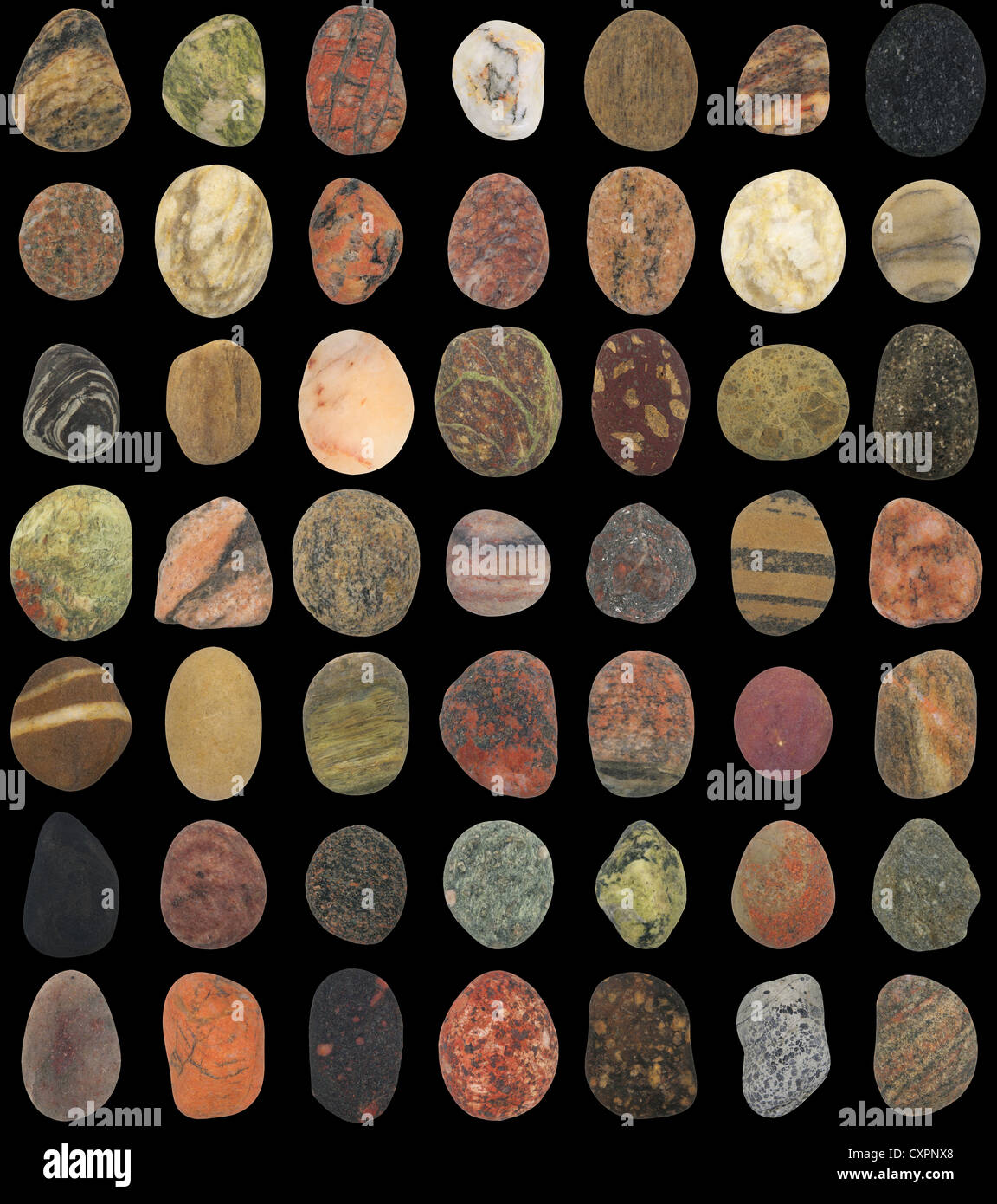 49 natural grounded beach stones isolated with hard edges on a black ...