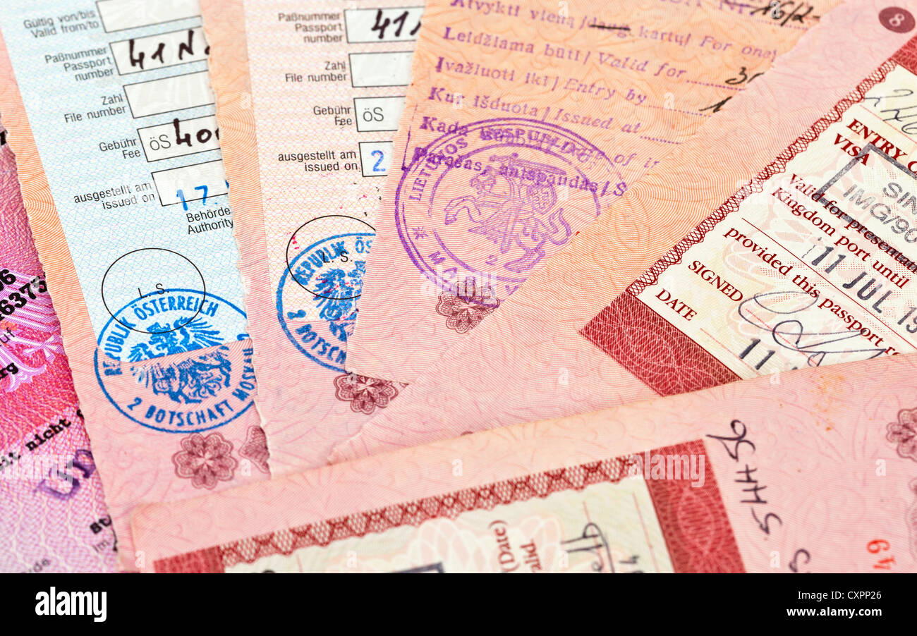 Visa entry and exit stamps in passport Stock Photo - Alamy