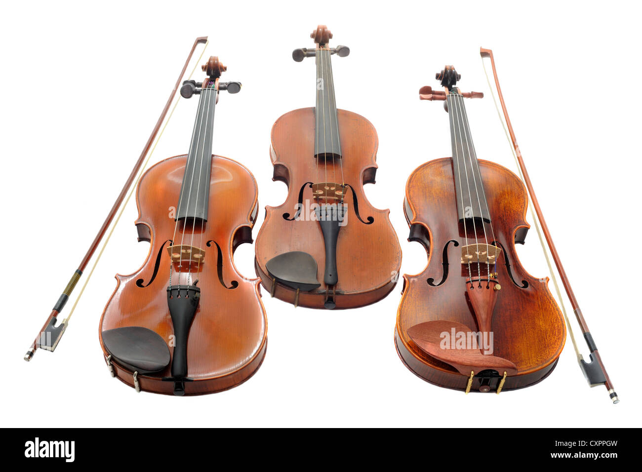 beautiful three violins isolated on a white background Stock Photo - Alamy