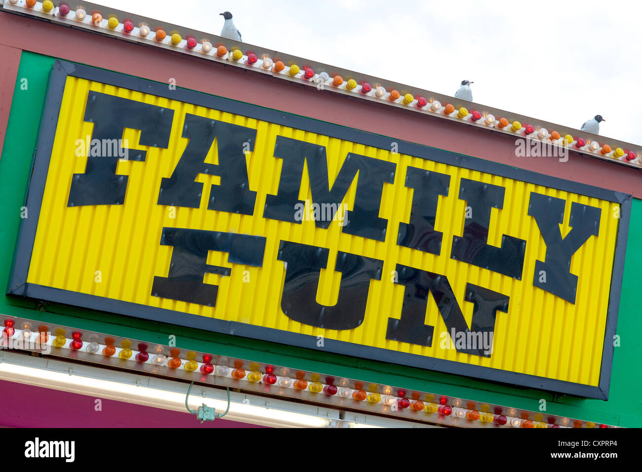 A Family Fun sign on an ocean boardwalk Stock Photo - Alamy